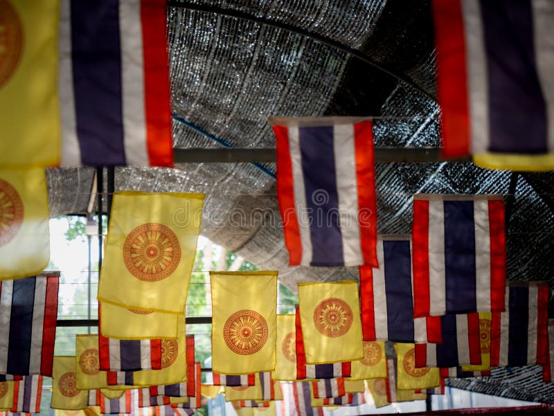 Wheel of Dhamma Flags Hanging on Rails Alternating with the Thai Flags ...