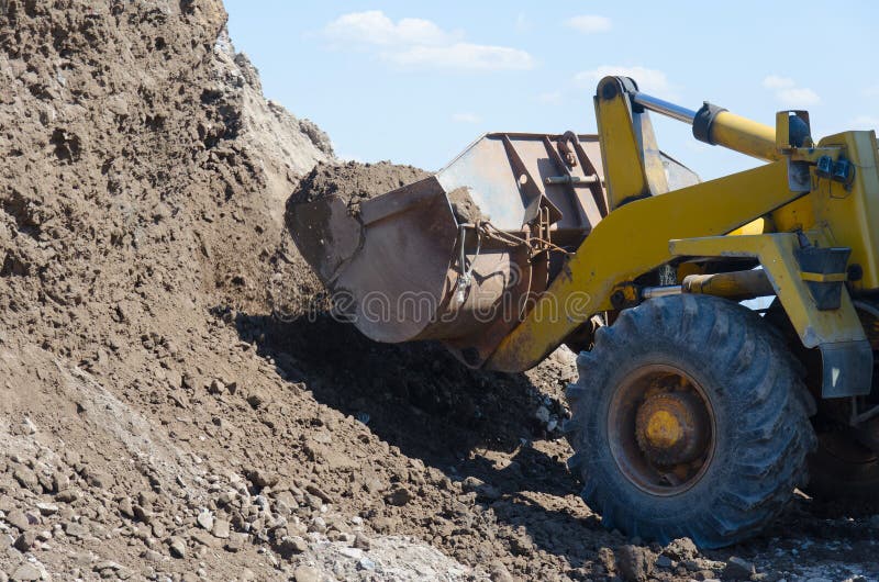 Wheel Excavator Digging Gravel Pile Stock Photo - Image of digging ...