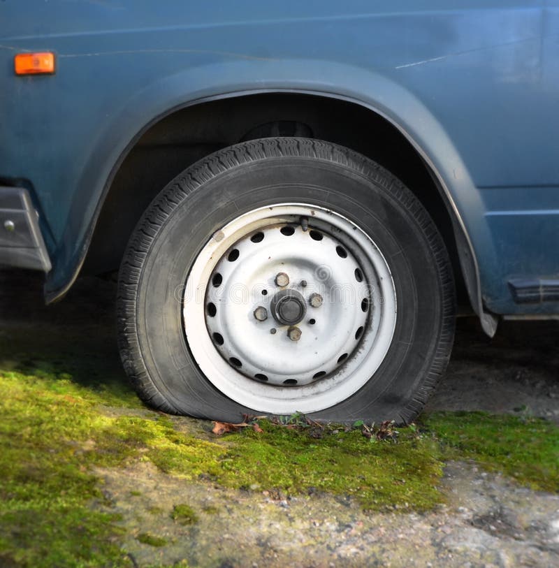 Wheel with a flat tire stock image. Image of metal, change - 108479307