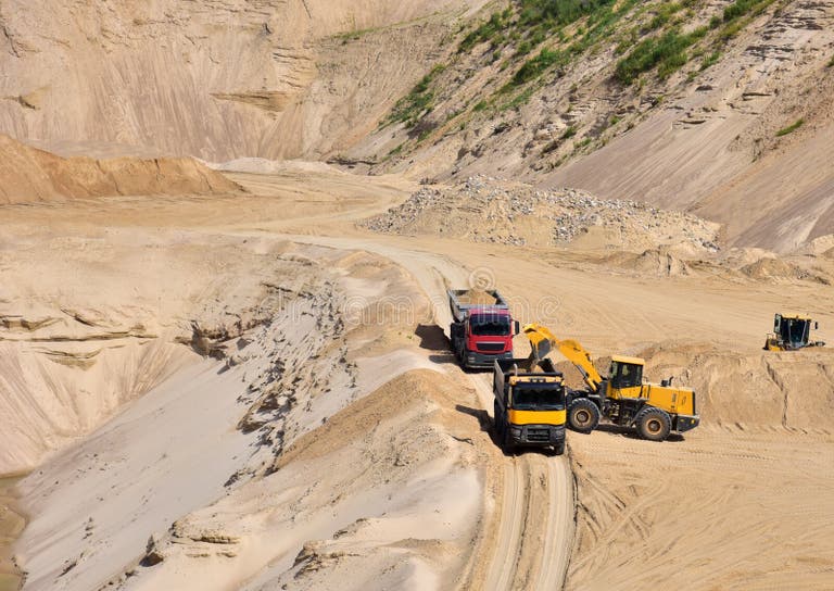 Wheel Front-end Loader Loading Sand into Heavy Dump Truck at the ...
