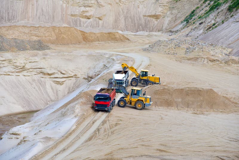 Wheel Front-end Loader Loading Sand into Heavy Dump Truck at the ...