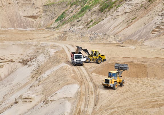 Wheel Front-end Loader Loading Sand into Heavy Dump Truck at the ...