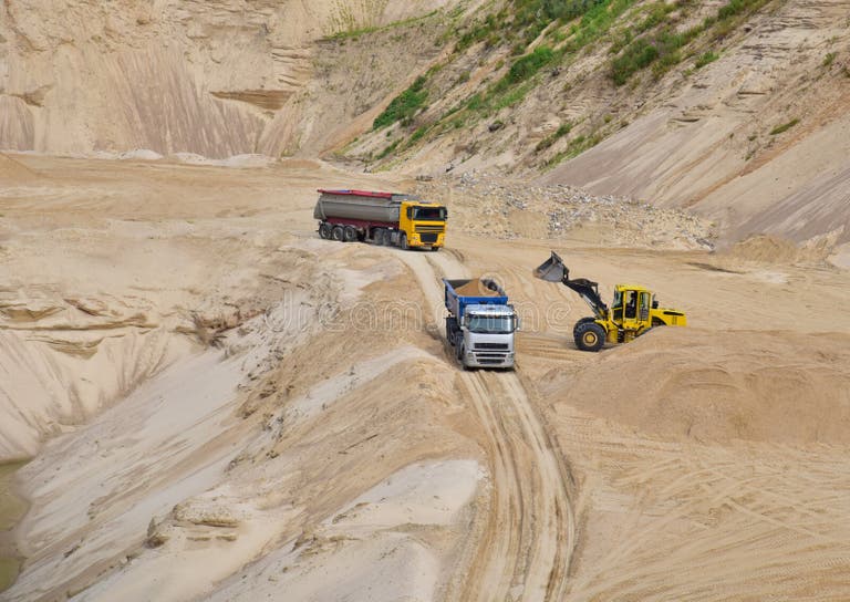 Wheel Front-end Loader Loading Sand into Heavy Dump Truck at the ...