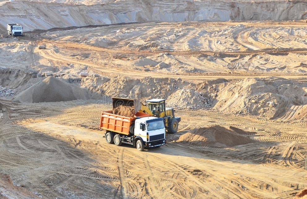 Wheel Front-end Loader Loading Sand into Heavy Dump Truck at the ...