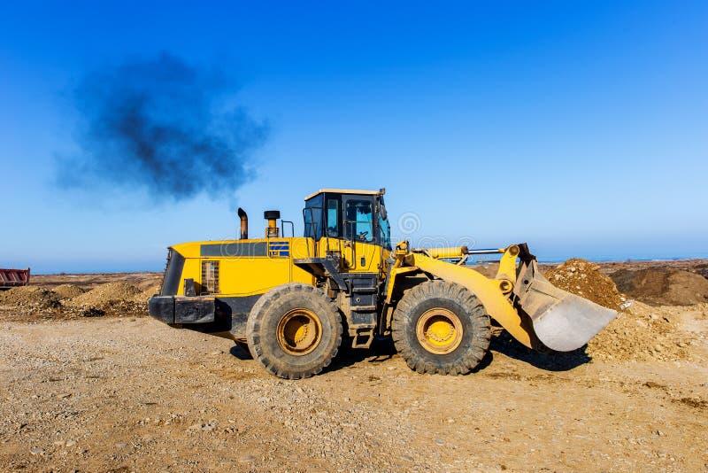 Wheel loader in action stock image. Image of eathmoving - 138149699