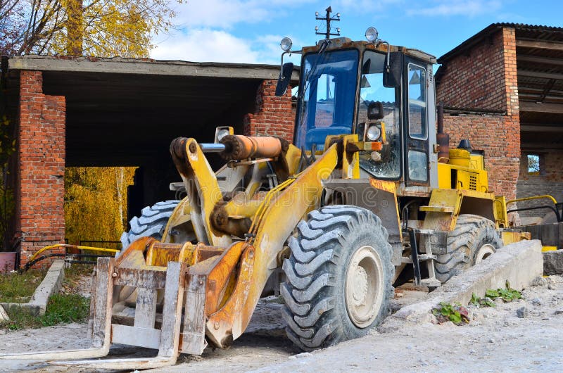 Wheel Loader on a Construction Site. Diesel Bulldozer with Bucket Stock ...