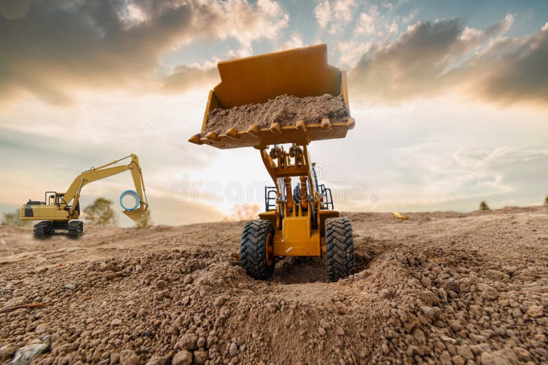 Wheel Loader and Crawler Excavator is Digging the Soil in Construction ...