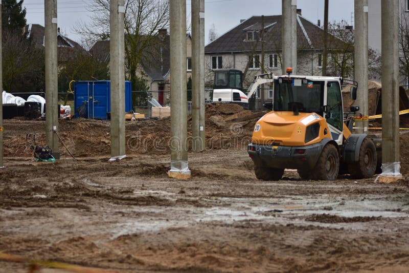 Wheel Loader Digging and Pushing Ground Around Building Columns Stock ...