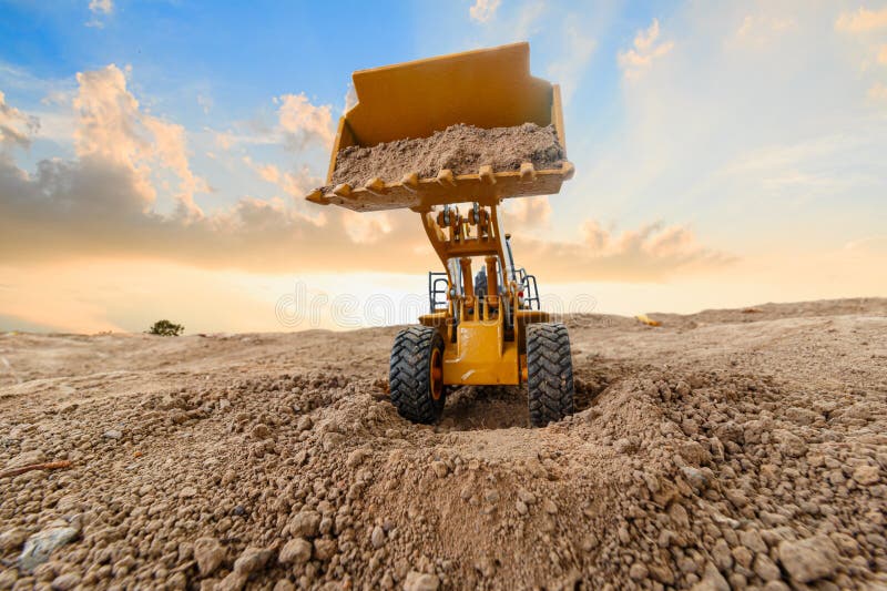 Wheel Loader are Digging the Soil in Construction Site with Bucket Lift ...