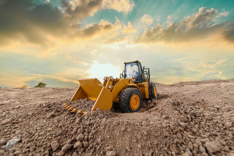 Wheel Loader Silhouette are Digging the Soil in the Construction Site ...