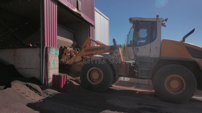 Wheel Loader Loading Crushed Stone it To the Dump Truck. Mining Work in ...