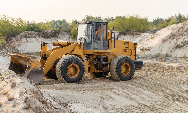 Wheel Loader Excavator at Work. Bulldozer Loading Sand Stock Photo ...