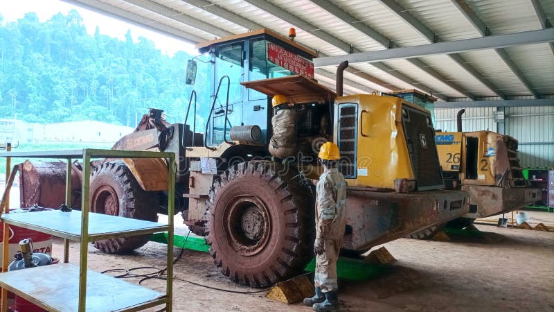 Wheel Loader Heavy Equipment Being Maintained by Mechanics in the ...