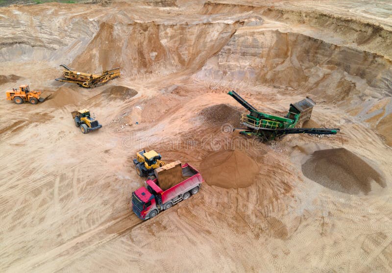 Wheel Loader Loading Sand into Dump Truck in Open Pit. Arial View of ...