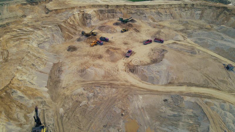 Wheel Loader Loading Sand into Dump Truck in Open Pit Mine. Arial View ...
