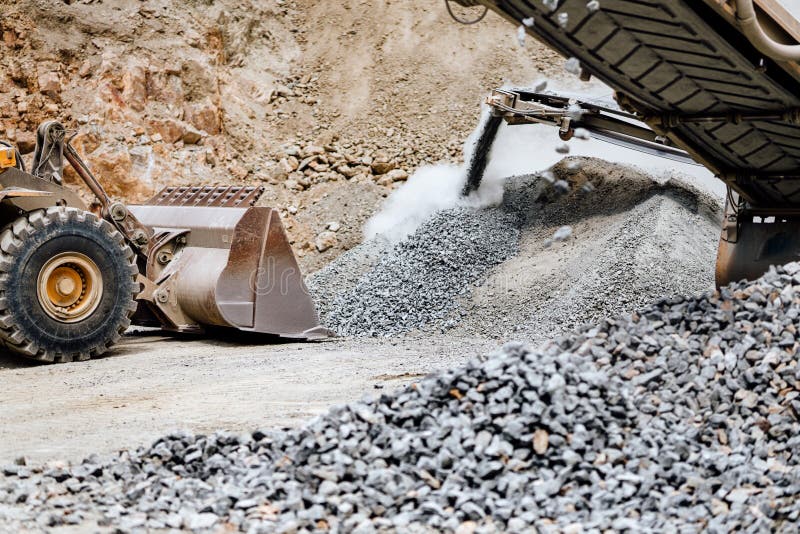 Wheel Loader Machine Loading Rocks in the Open Mine, Iron Ore Mining ...