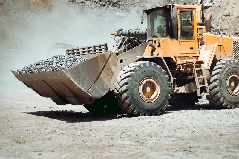 Large Wheel Loader on Quarry Site Transporting and Loading Gravel into ...