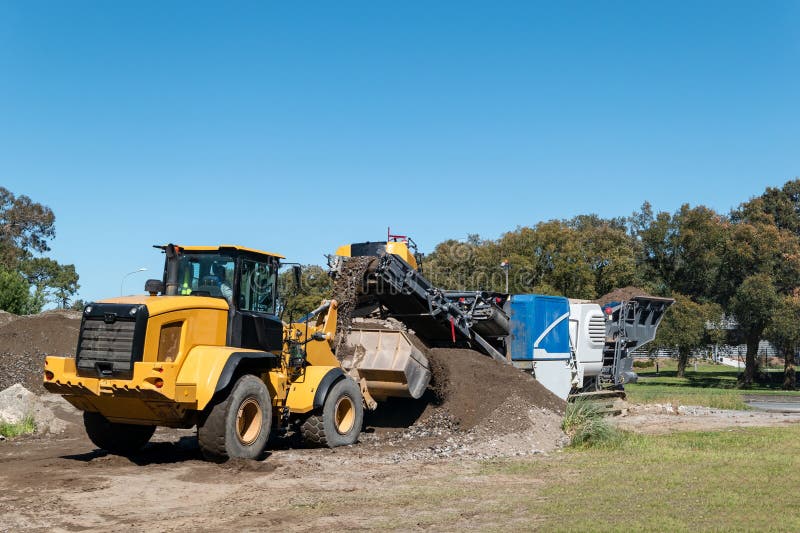 Maneuvers in the Quarry: Loader in Action, Transporting Crushed Gravel ...