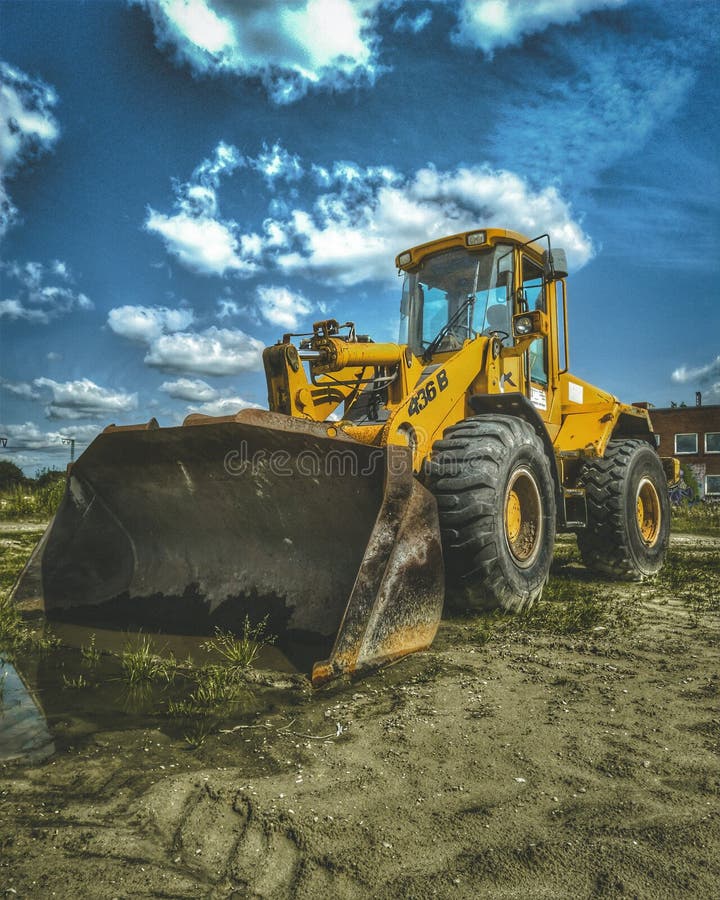 Wheel Loader in the Sand on a Construction Site Editorial Image - Image ...