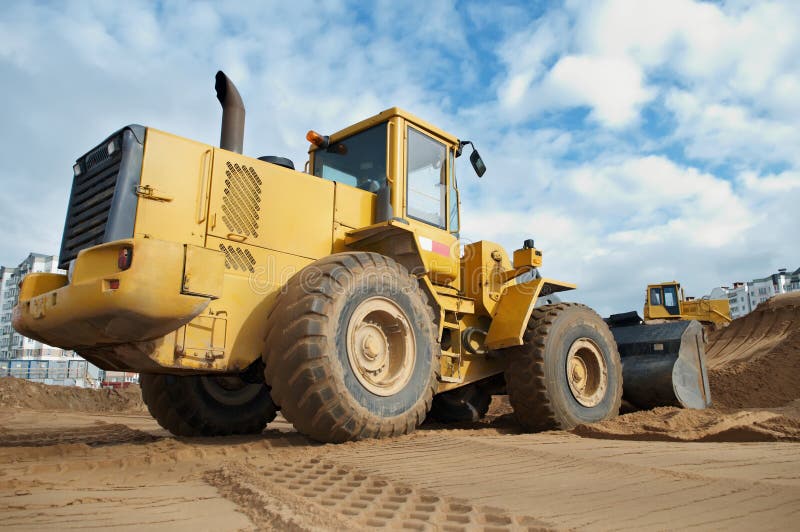 Wheel loader at work stock photo. Image of action, bulldozer - 15422412