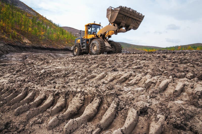 Wheel loader at work stock image. Image of employment - 194986077