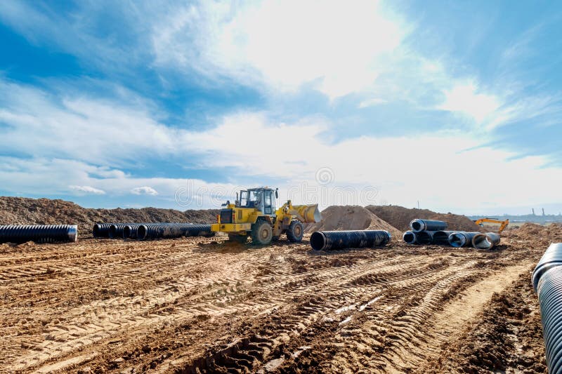 Wheel Machine for Loading Performs Work on Laying Large Diameter Pipes ...