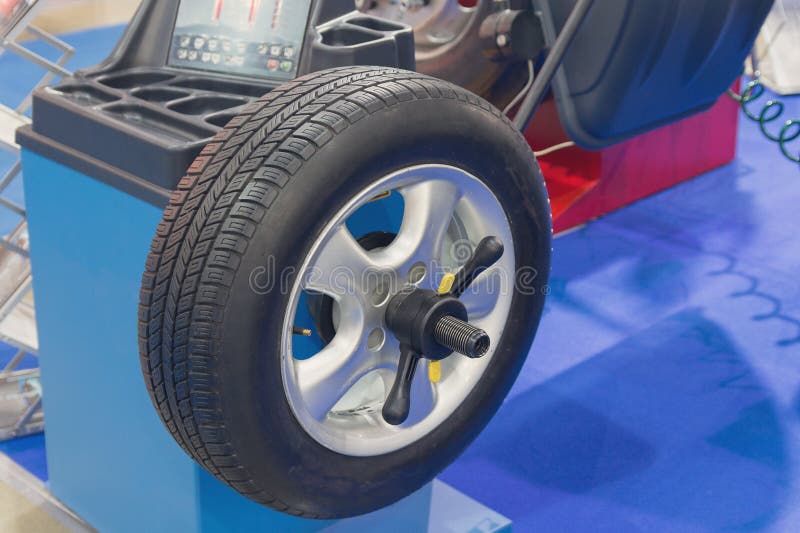 Wheel on the Machine in the Tire Fitting Stock Photo - Image of garage ...