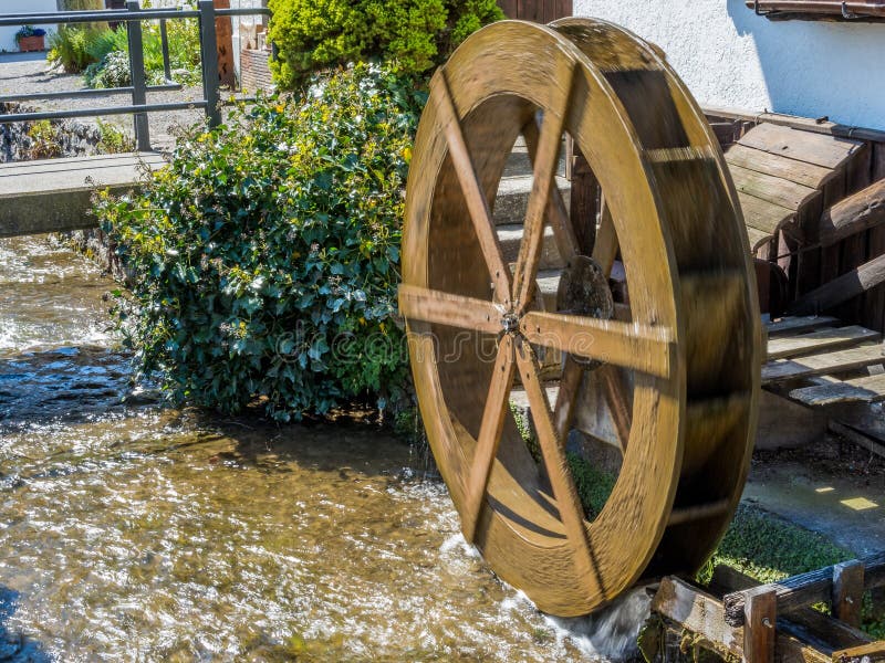 Wheel of a Mill in Switzerland - 2 Stock Image - Image of blurry, gear ...