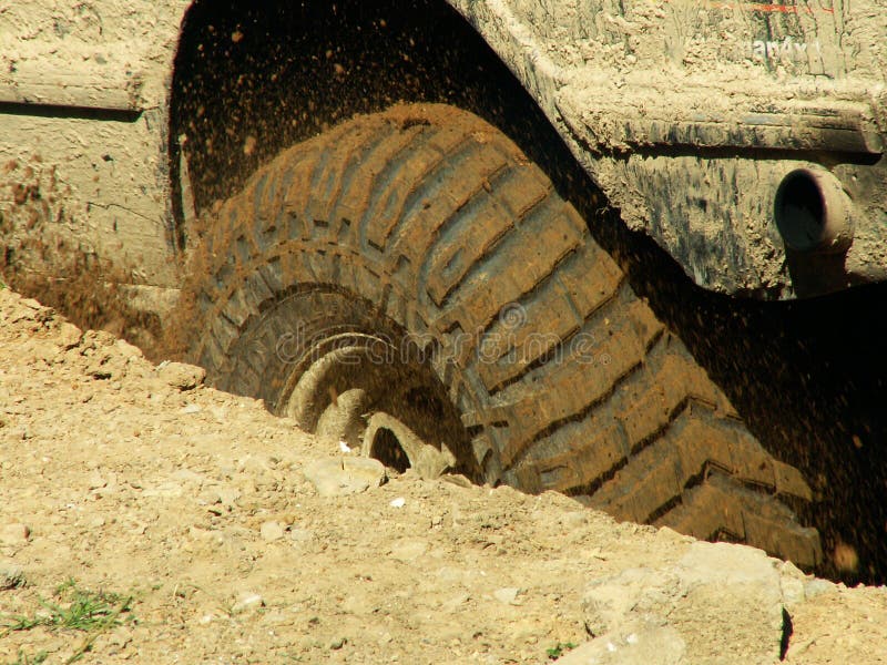 A Wheel in the Mud. stock image. Image of splashing, outdoors - 70398115