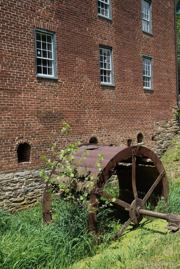 The Wheel of an Old Water Mill. the Rusty Metal of Broken Blades Stock ...