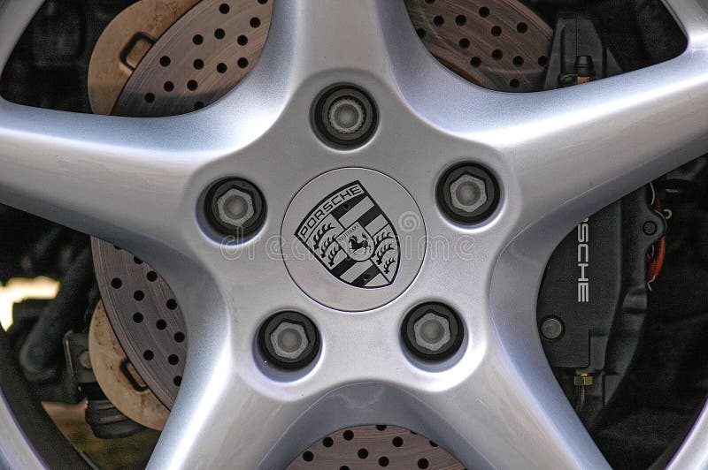 Wheel with Porsche logo editorial stock photo. Image of bumper - 304503823
