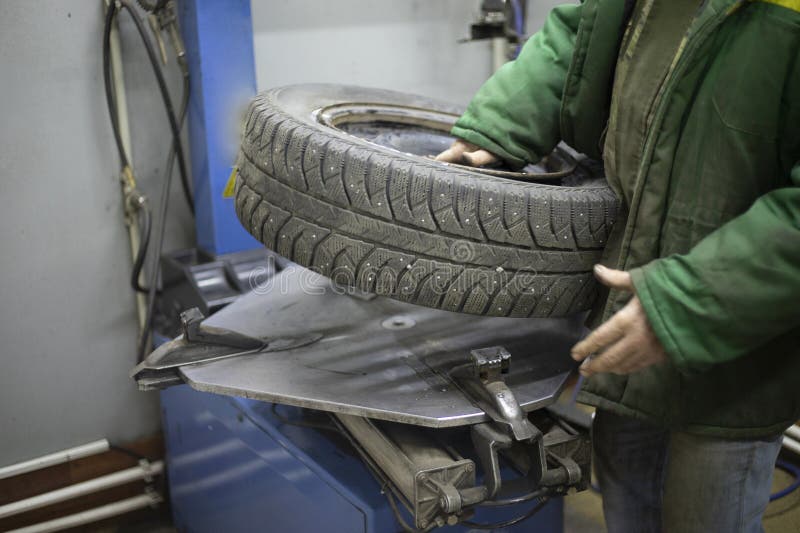 Wheel Repair. Tire Fitting of a Car Wheel Stock Photo - Image of ...