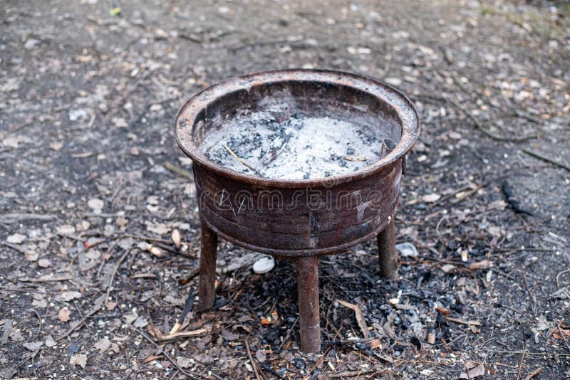 Wheel Rim Fire Pit in the Forest with Flames Inside Stock Photo - Image ...