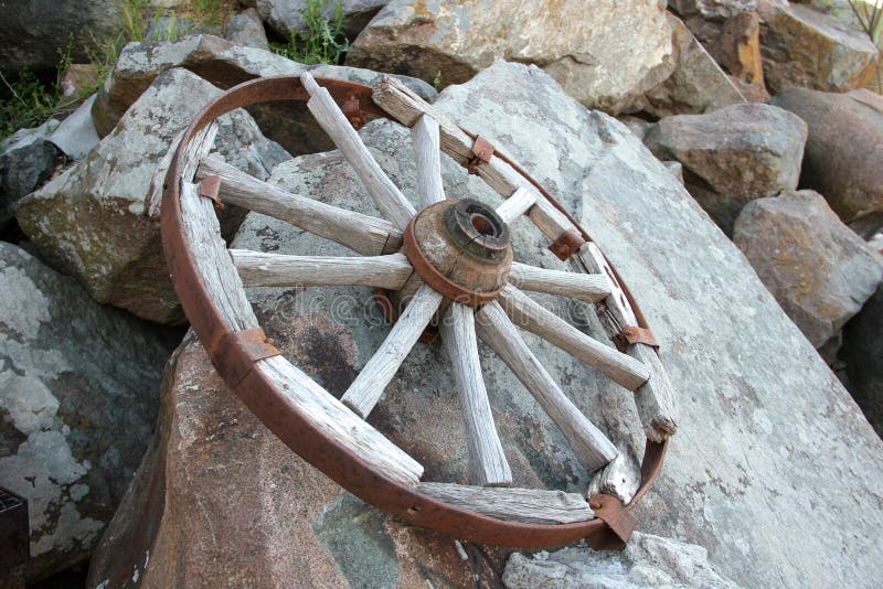 Wheel on the rock stock photo. Image of historical, retro - 91917412