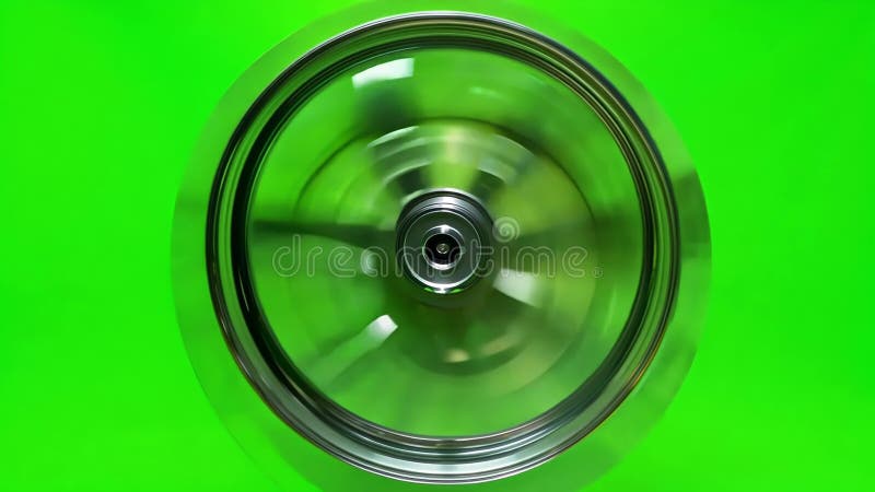 A Wheel Spinning Quickly Blurring the Details Around the Edges. Green ...