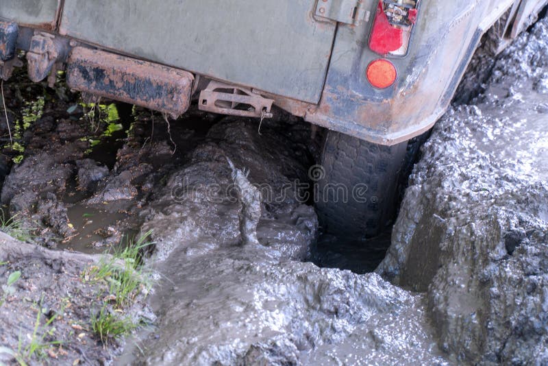 Wheel of an SUV Stuck in Deep Mud on an Impassable Country Road Stock ...