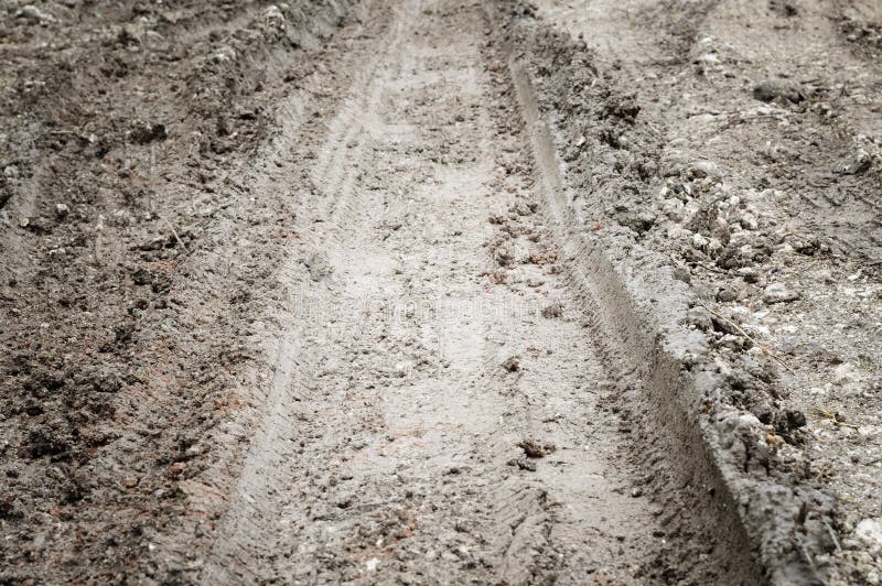 Wheel track on the ground stock photo. Image of track - 242779434