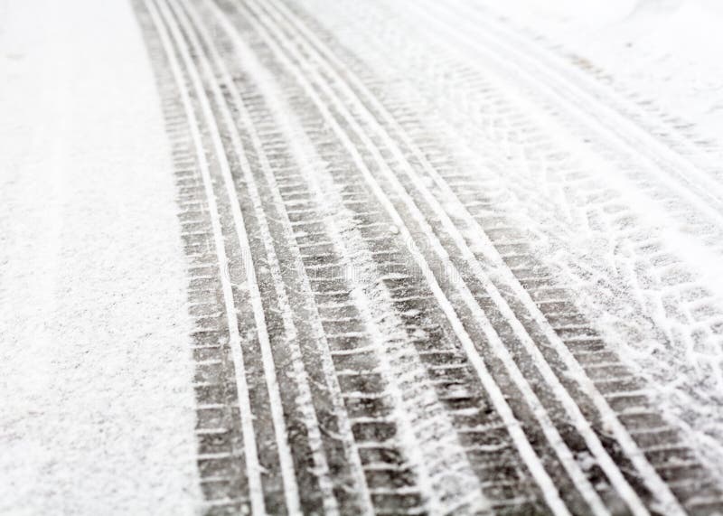 Wheel Tracks on the Road Covered with Snow Stock Photo - Image of ...