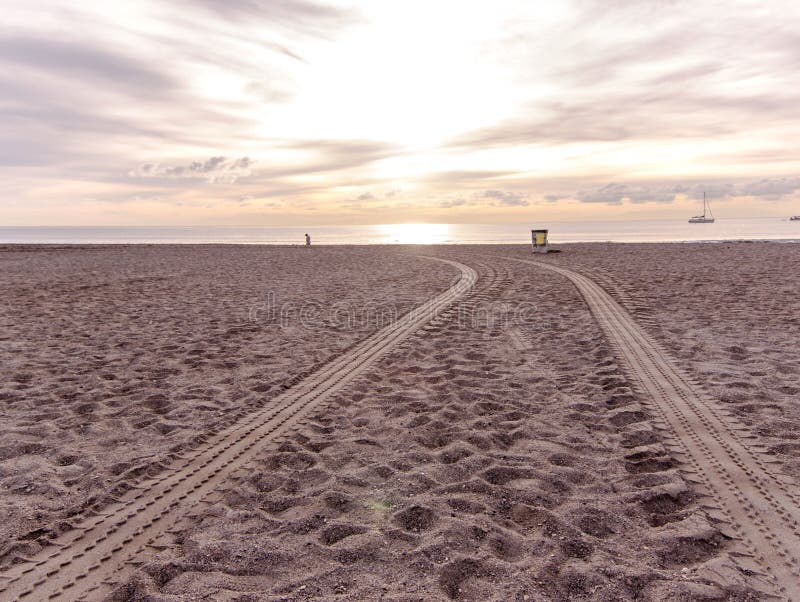 Wheel Tracks in the Sand stock image. Image of abstract - 245250237