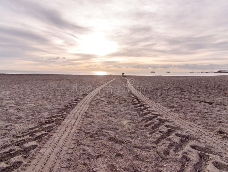 Wheel Tracks in the Sand stock image. Image of track - 243501723