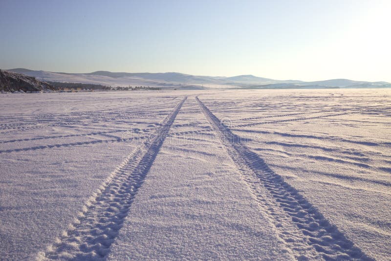 Wheel Tracks on the Winter Road Covered with Snow Stock Image - Image ...