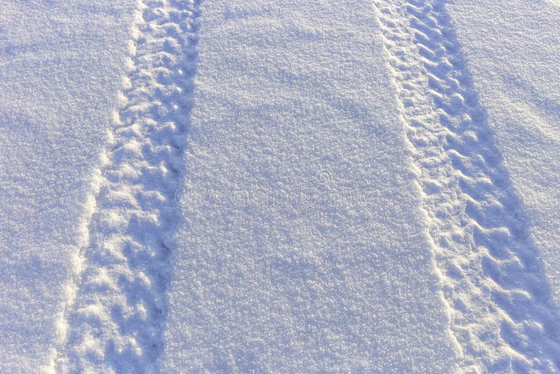 Wheel Tracks on the Winter Road Covered with Snow Stock Photo - Image ...