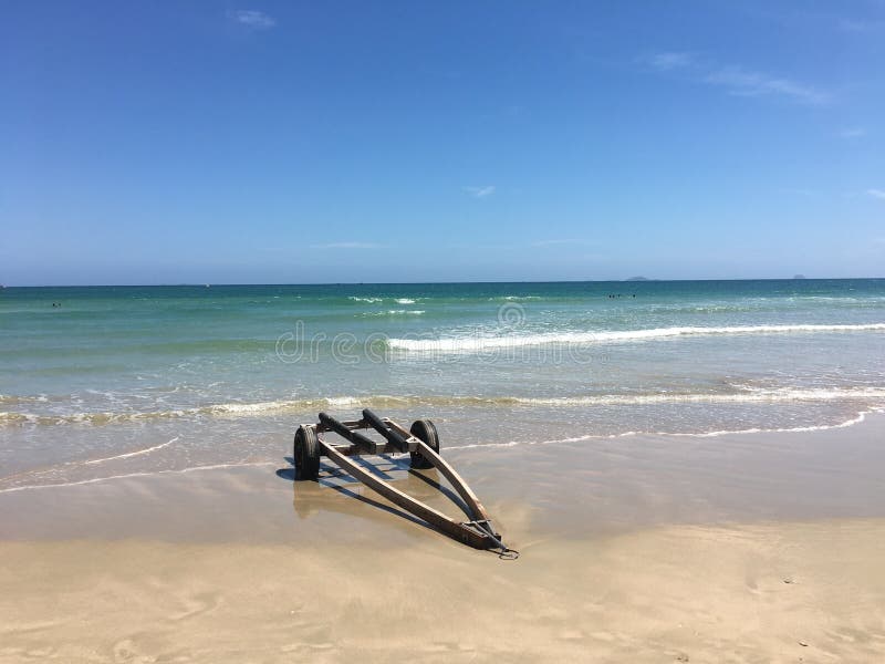 The Wheelbarrow on the Beach with Sea Wave Foam Stock Photo - Image of ...