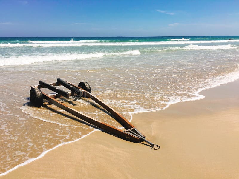 The Wheelbarrow on the Beach with Sea Wave Foam Stock Image - Image of ...