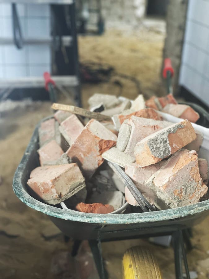 Wheelbarrow and bricks stock image. Image of home, bricks - 343330827