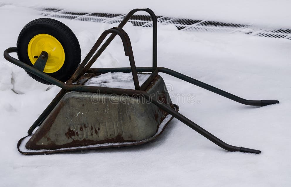 Wheelbarrow Dumped in the Snow Stock Image - Image of metal, industrial ...