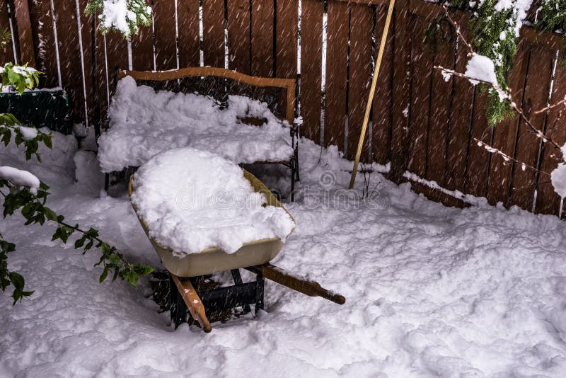 Wheelbarrow and fresh snow stock image. Image of bench - 54018295