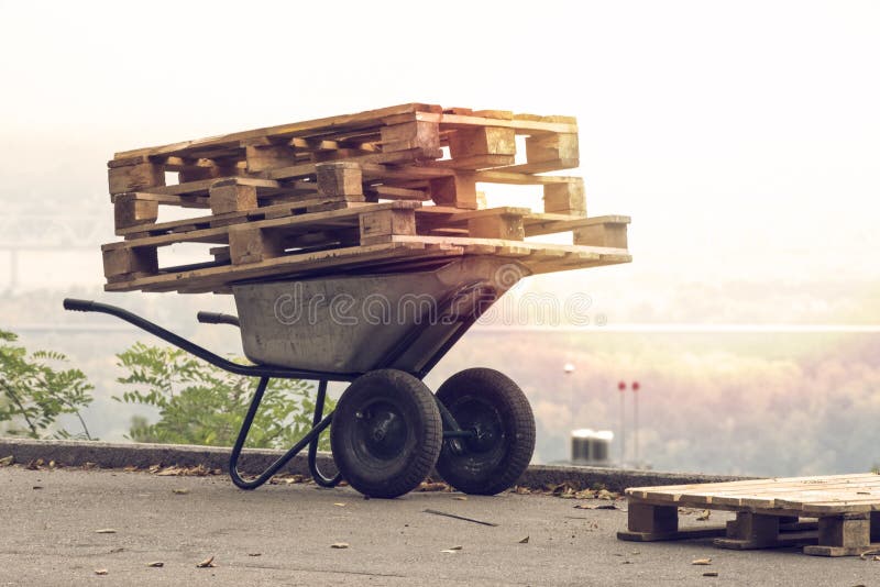 Wheelbarrow and pallets stock image. Image of work, equipment - 81259371