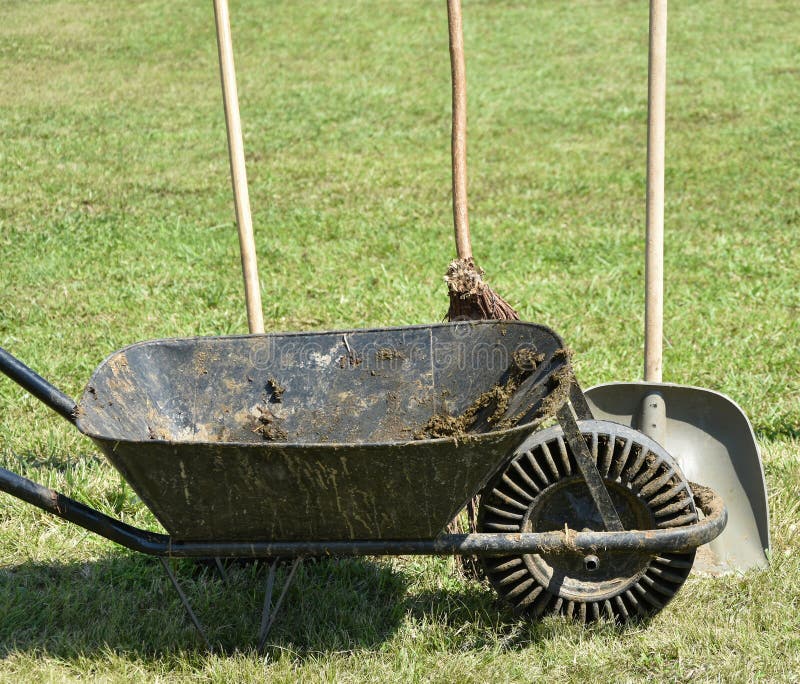 Wheelbarrow and shovel stock photo. Image of broom, grass - 77037320