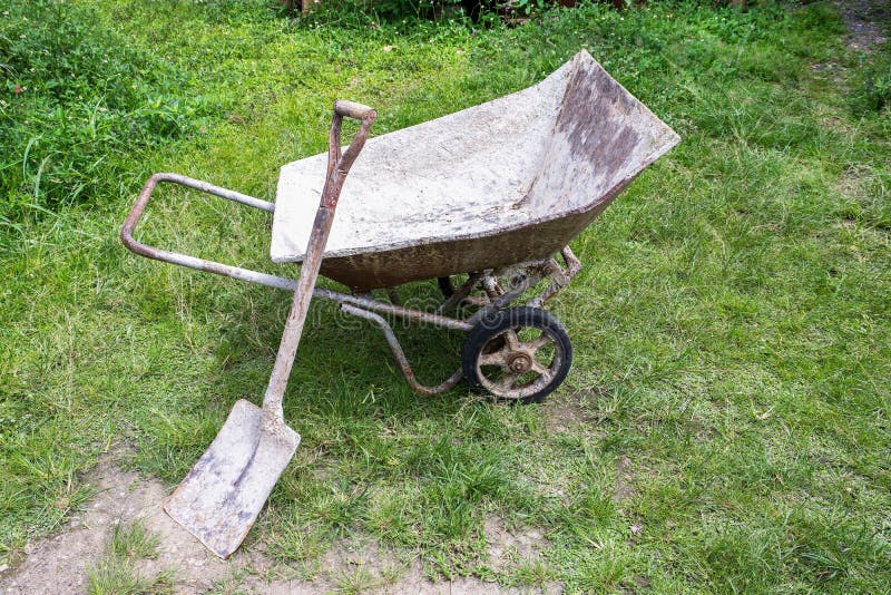 Wheelbarrow With A Shovel And Rake Stock Image - Image of split ...